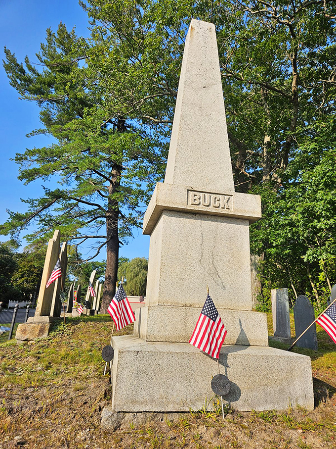 American flags flutter among the historic gravestones, adding patriotic color to this cemetery that houses one of Maine's most enduring mysteries.