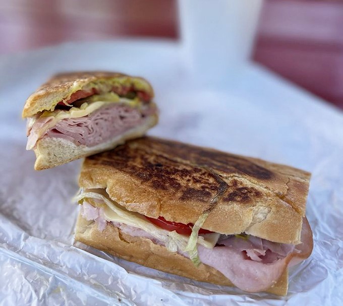 Behold the legendary Cuban sandwich &ndash; layers of ham, pork, and Swiss cheese pressed between crispy bread that shatters with each heavenly bite.