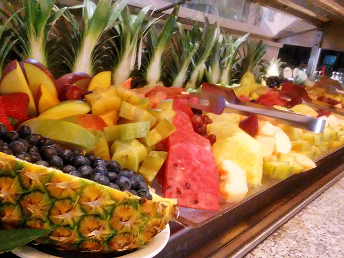 Nature's candy counter! This fruit display is so vibrant and fresh, you'll almost forget about the chocolate fountain lurking just around the corner.