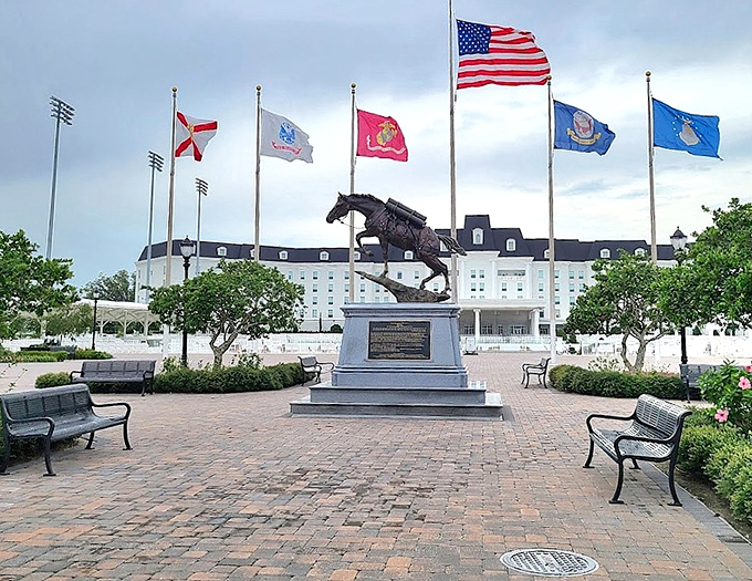A powerful bronze horse statue leaps eternally skyward, capturing the spirit and grace that defines this equestrian paradise.