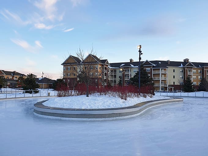 The ice skating area gleams under winter skies, offering 810 feet of smooth surface where grace and gravity engage in their eternal dance.