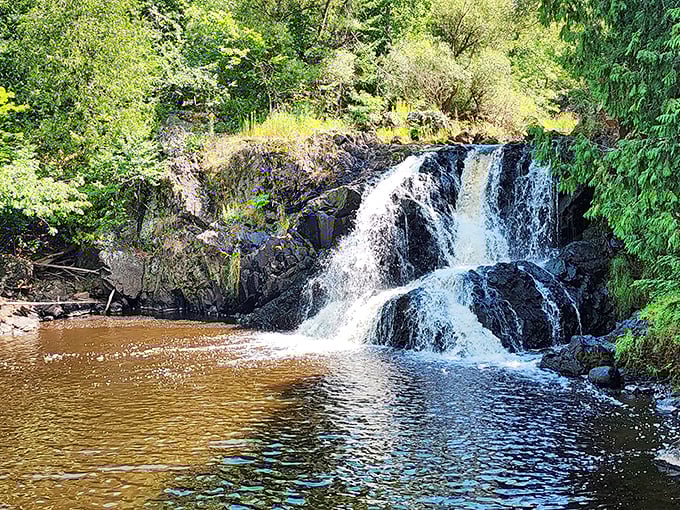 Interstate Falls cascades over ancient rock formations, creating nature's perfect soundtrack &ndash; like Mother Nature turned up the volume on serenity.