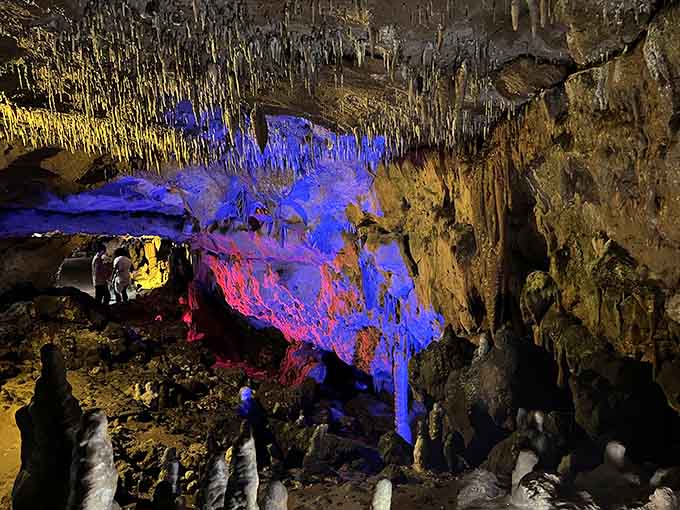 LED lighting transforms ancient limestone into a psychedelic light show that no concert could match.