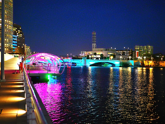 When night falls, Tampa's Riverwalk transforms into a neon wonderland that would make Las Vegas blush. The water becomes a mirror for this electric ballet.
