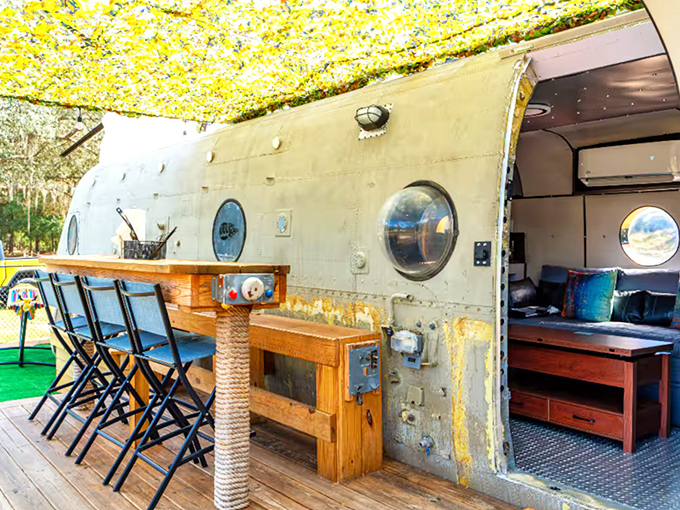 Morning coffee hits differently when sipped on a wooden deck attached to a military helicopter turned vacation rental.