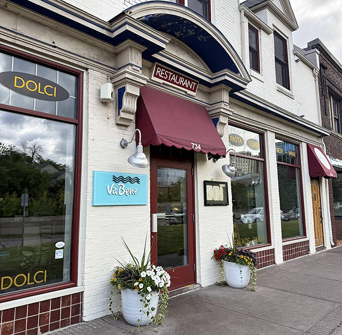Where authentic Italian cuisine meets Lake Superior views, this charming restaurant's burgundy awning signals the promise of pasta perfection.