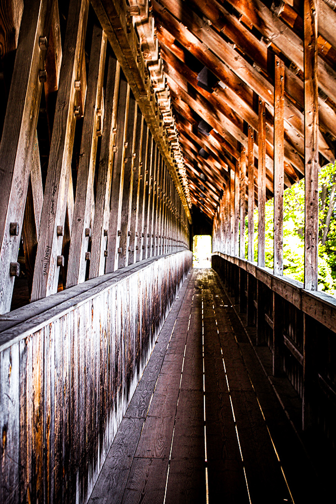 Walking through this wooden masterpiece reveals intricate craftsmanship, where sunlight plays hide-and-seek between carefully placed slats and sturdy beams.