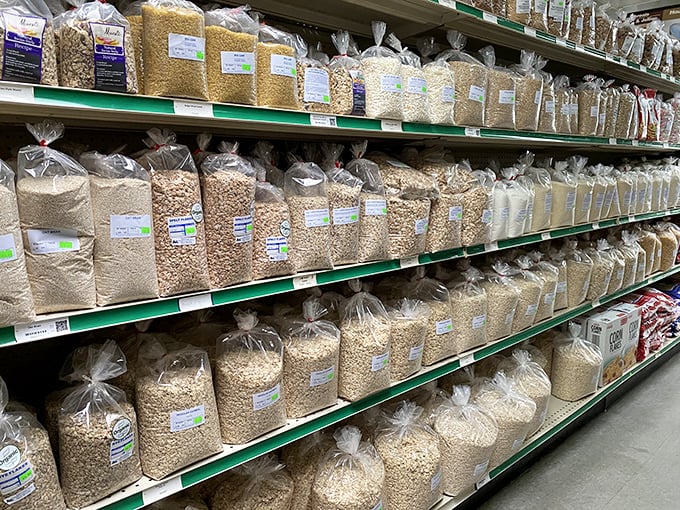 A baker's paradise awaits with every grain, legume, and baking ingredient imaginable, all displayed in clear bags with simple labels.