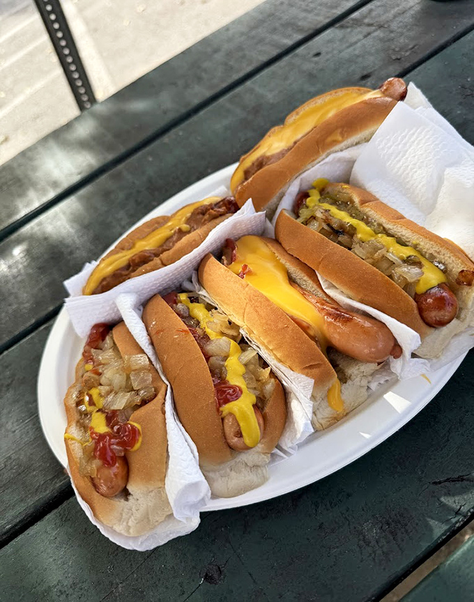 Hot dog heaven on a plate! These beauties showcase the perfect char marks that only come from proper grilling technique and decades of experience.