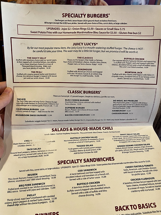 The menu reads like a love letter to excess &ndash; specialty burgers with cheese hidden inside, sandwiches stacked high, and sides that deserve their own fan club.