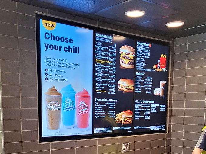 Modern menu, timeless setting: Digital menu boards display familiar favorites while maintaining the location's unique blend of contemporary and historical elements. 