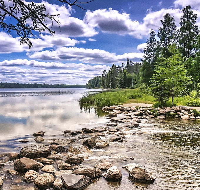 Crystal-clear waters meander through smooth stones, marking the humble beginnings of America's most famous river.