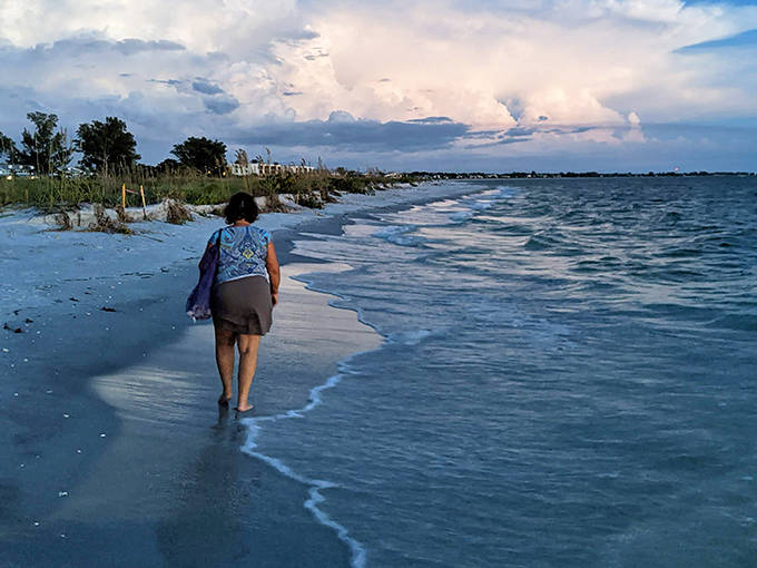 Footprints in the sand tell stories of beachcombers past, while gentle waves create a soothing soundtrack for coastal wanderers.