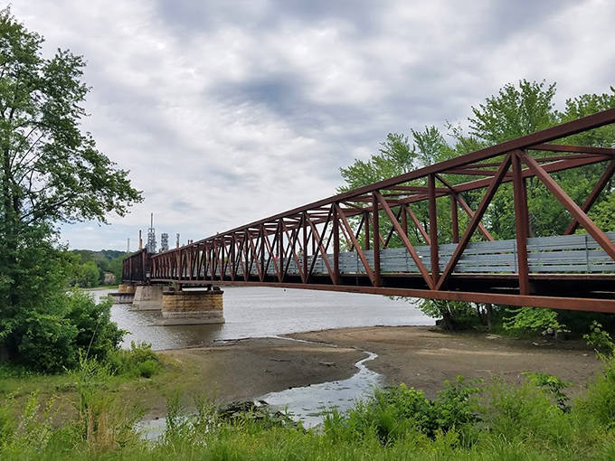 The bridge's weathered profile against Minnesota's verdant landscape creates a striking contrast that photographers can't resist capturing.