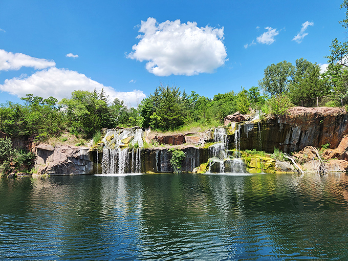 Water tumbles dramatically over rich red granite, creating nature's perfect soundtrack &ndash; part lullaby, part rock concert, all spectacular.