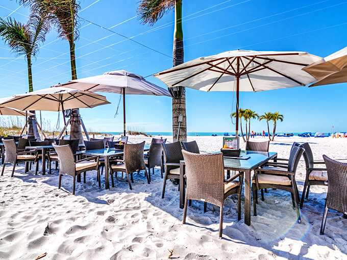 Beach party central! Bongos' white umbrellas and tables planted right in the sand create the ultimate casual dining experience on St. Pete Beach.