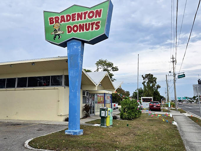Bradenton Donuts' vintage sign stands tall against the Florida sky, a landmark for locals seeking classic donut perfection.