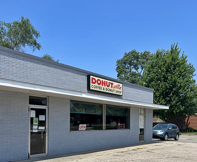 Donutville USA's simple white building houses extraordinary donut treasures that Holland locals line up for daily.