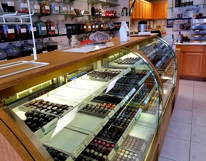 Jan's Homemade Candies' glass display cases reveal rows of handcrafted chocolates, each one made with care in this beachside chocolate haven.