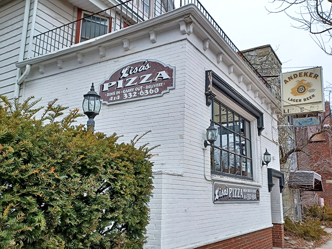 Lisa's Pizza's charming white brick exterior and vintage signage has become a beloved Milwaukee landmark for pizza aficionados seeking thin-crust perfection.