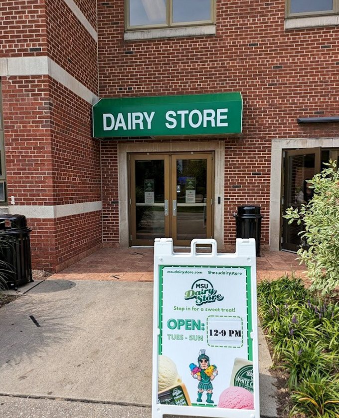 The simple green "DAIRY STORE" sign marks the entrance to MSU's ice cream paradise, where education and indulgence blend perfectly.
