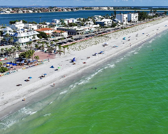 Pass-a-Grille's classic beachfront stretches into the distance, where old Florida charm meets Gulf of Mexico splendor.