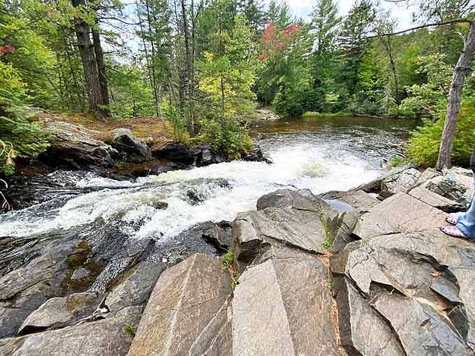 Twelve Foot Falls creates a perfect curtain of white water, surrounded by lush greenery in Wisconsin's waterfall country.