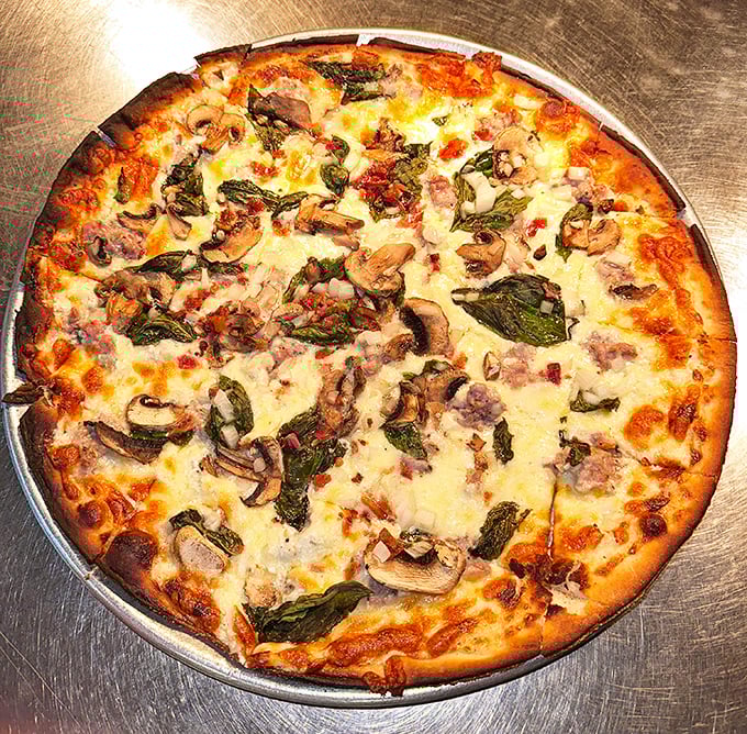 A gourmet specialty pizza from Lisa's showcases their perfect balance of fresh toppings, melted cheese, and that impossibly good crust that keeps locals coming back.