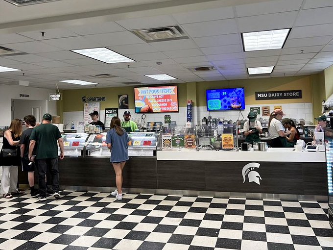 Inside MSU Dairy Store, students serve up Spartan pride by the scoop on a classic black and white checkered floor.