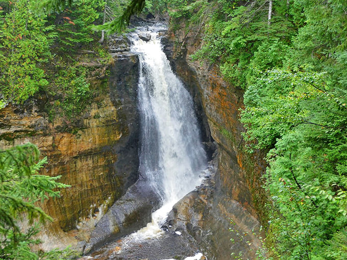 The powerful plunge creates a misty show that catches sunlight and turns it into dancing rainbows for lucky visitors.