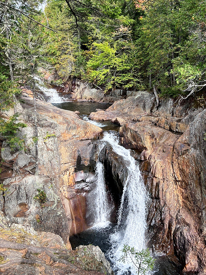 The multi-tiered cascade at Smalls Falls creates nature's perfect staircase, each step offering a new pool for summer splashing.