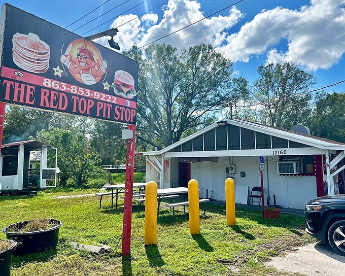 That cheerful pig sign tells you everything you need to know – serious BBQ happens here. The picnic tables invite you to enjoy your feast outdoors.