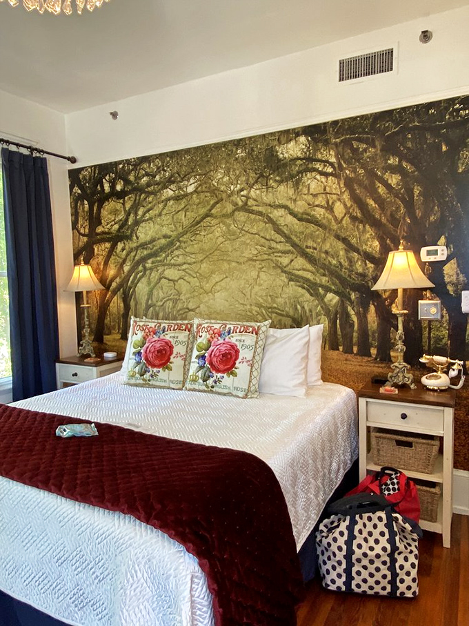Dream beneath a canopy of painted oak trees in this enchanting bedroom where nature's beauty follows you indoors.