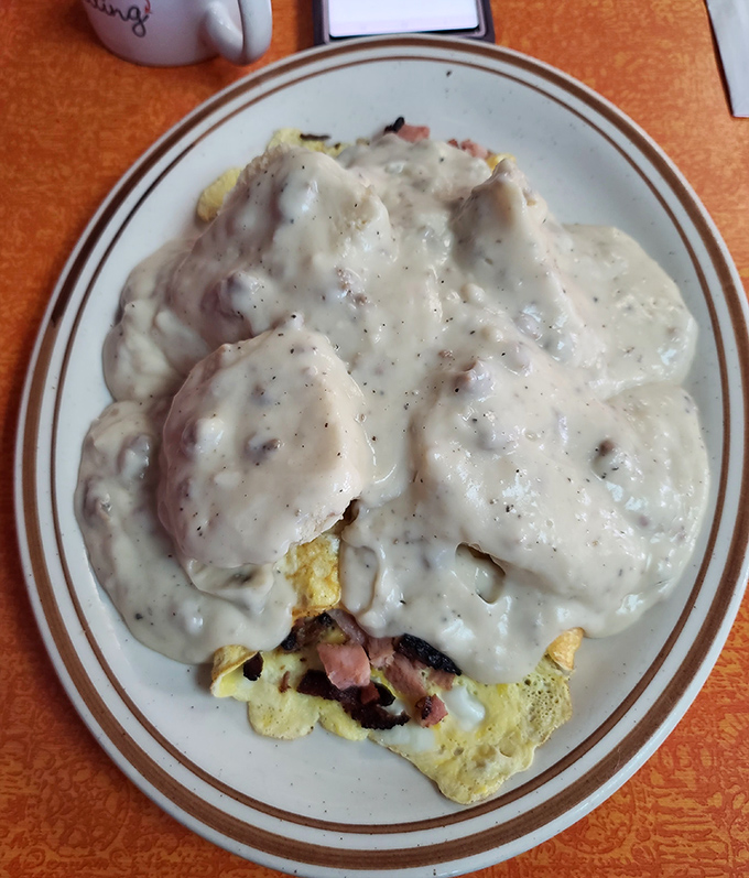 Biscuits and gravy that would make your grandmother jealous—a creamy, peppery blanket of goodness covering fluffy homemade biscuits.