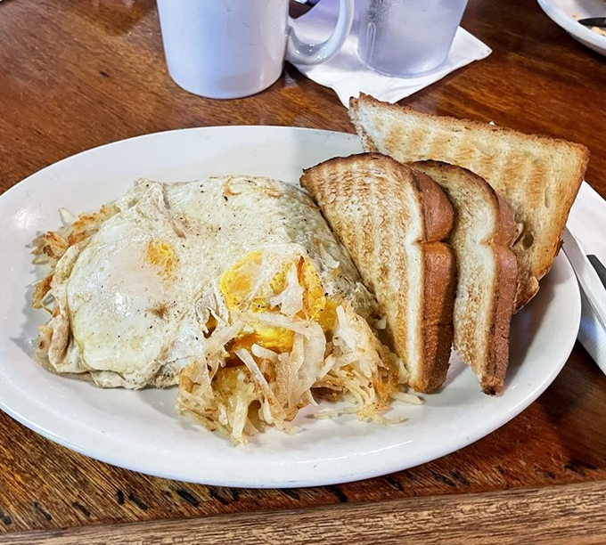 Golden hash browns, perfectly cooked eggs, and toast create the breakfast trifecta that fuels perfect Saturday mornings.