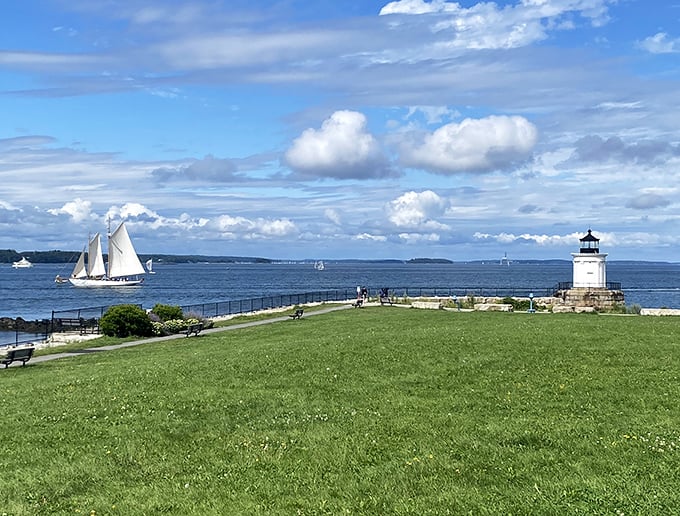 Bug Light Park offers postcard-perfect views where sailboats glide past the diminutive lighthouse standing guard like a Greek temple by the sea.