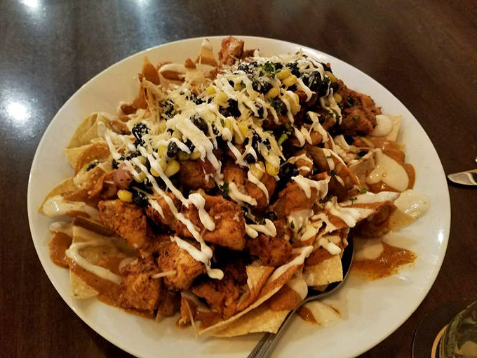 Chicken Nachos: These aren't your average ballpark nachos &ndash; they're a mountain of flavor that might require climbing gear and definitely requires sharing.hos