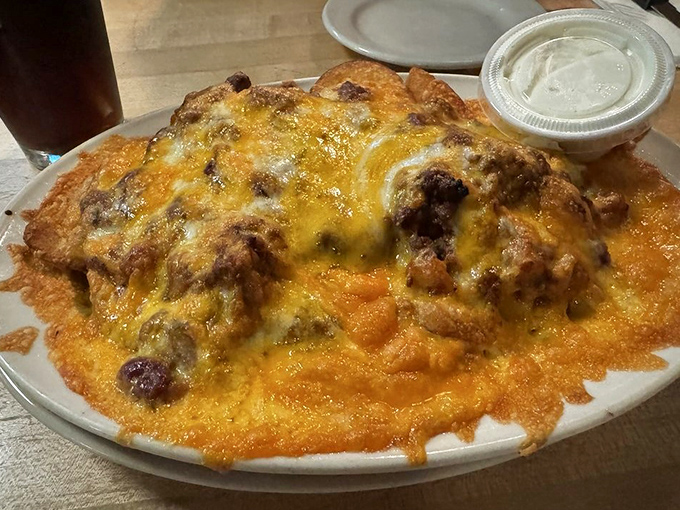 Mountains of golden fries disappear beneath a lava flow of chili and melted cheese &ndash; a fork-required affair that's worth every napkin.