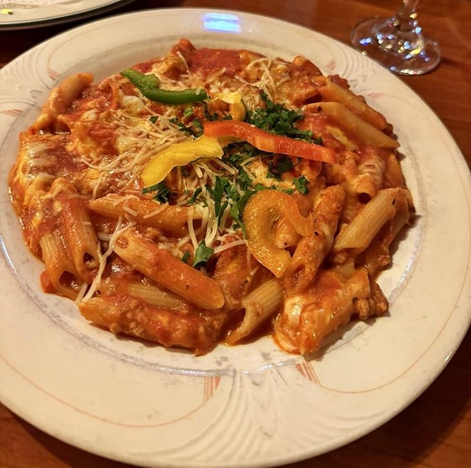 Five cheeses unite in creamy harmony atop perfectly cooked penne, proving that sometimes more really is more.