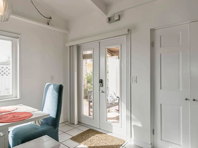 Natural light floods through glass doors that frame your pathway to paradise like the world's best picture window.