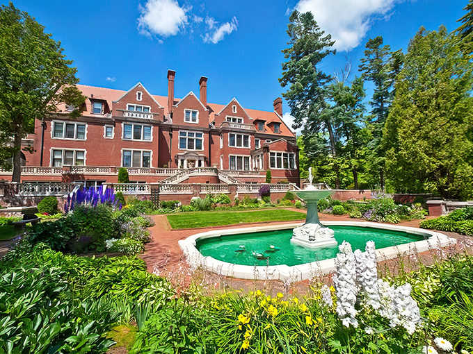 This red-brick Tudor mansion isn't just architectural eye candy, it's a time capsule of Gilded Age opulence with gardens that rival the interior splendor.
