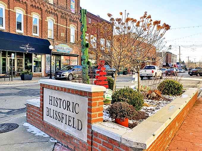 Historic Blissfield's brick marker stands sentinel at the entrance to a downtown where every building has stories to tell.