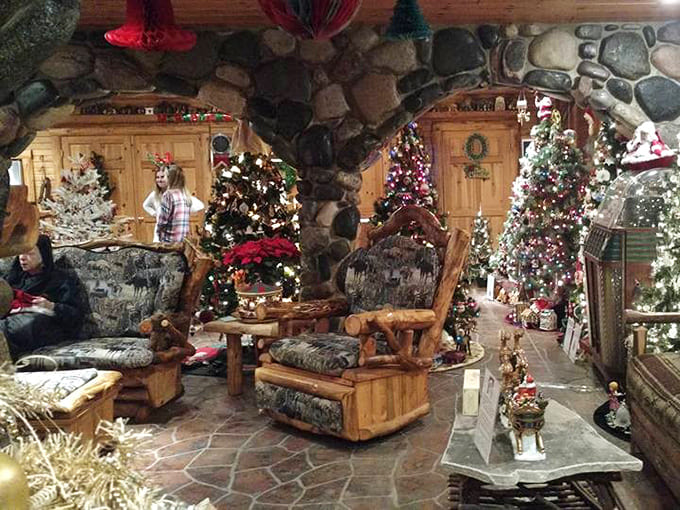 Rustic luxury meets holiday extravagance in this stone-hearth living area. Even the furniture looks like it's waiting for Santa.