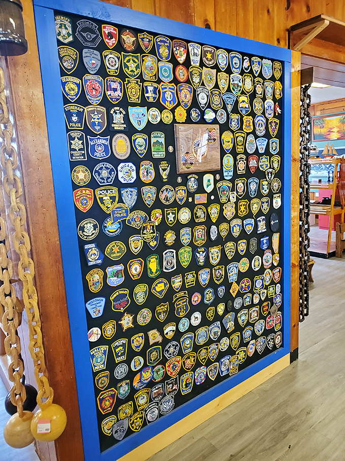 A mosaic of law enforcement patches creates an unexpected art installation, bridging worlds that rarely intersect except in this unique space.