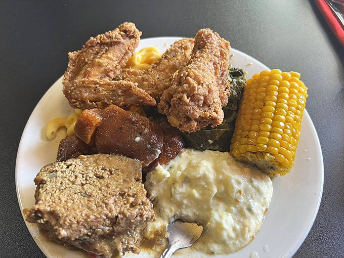 The ultimate soul food symphony &ndash; crispy chicken, savory meatloaf, and sides that deserve their own spotlight compete for your affection.
