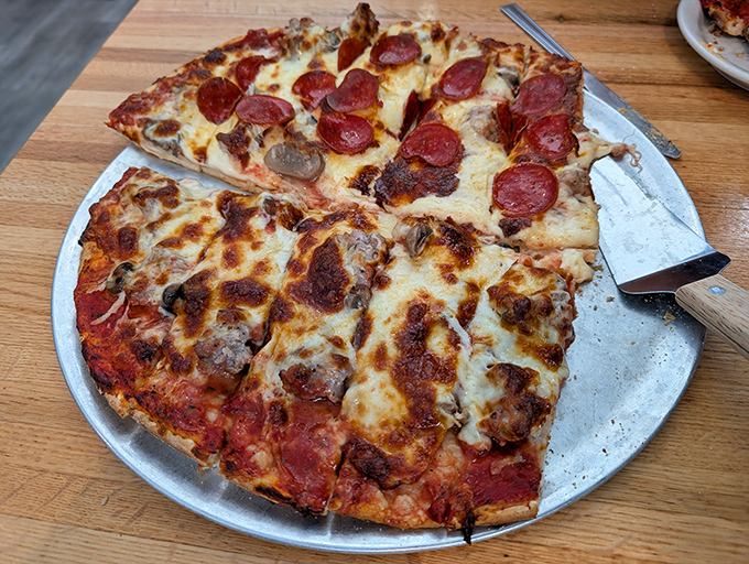 Michiana-style pizza perfection &ndash; cheese on top, toppings tucked safely underneath &ndash; a regional specialty that defies gravity and delights taste buds.