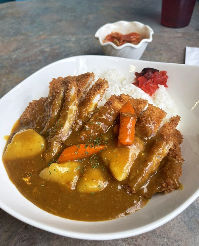 This Chicken Katsu Curry is comfort food perfection &ndash; crispy panko-crusted cutlet swimming in golden curry with potatoes and carrots over rice.