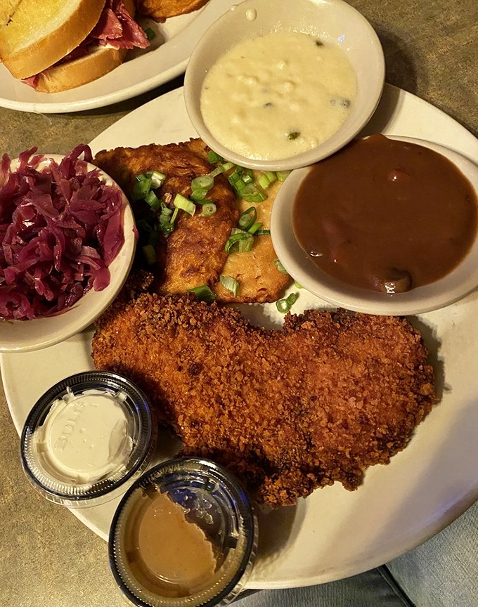 Golden-brown perfection on a plate &ndash; this crispy cutlet with red cabbage and potato pancakes is what comfort food dreams are made of.