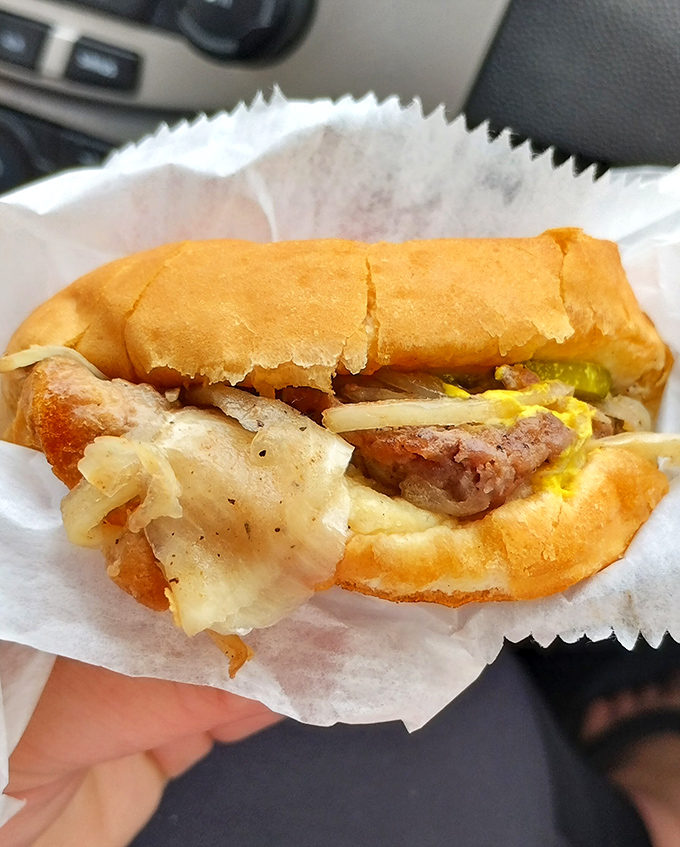 This isn't just a slider; it's a Detroit institution between two buns. Grilled onions cascade over the patty in a symphony of savory perfection.