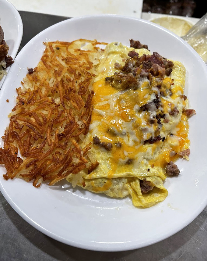 This Denver omelet with crispy hash browns proves that breakfast perfection doesn't need reinvention &ndash; just quality ingredients and proper execution.